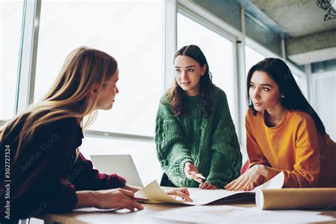 Serious Caucasian Women Team Of Architects Discussing Strategy And Solution Together Checking