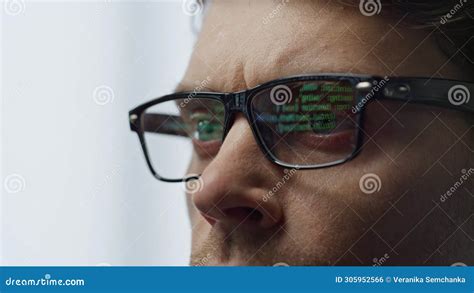 software developer glasses reflecting terminal code closeup it man