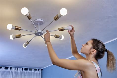 Premium Photo Home Light Bulb Replacement By Woman In Bedroom