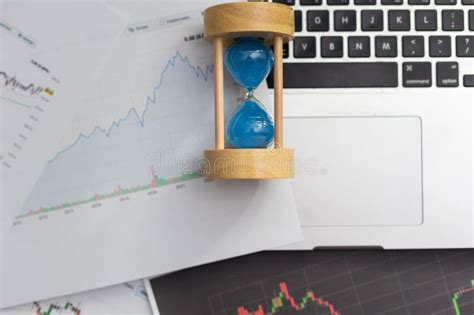Clock Alarm With Stock Graph Chart In Laptop Screen Background Time
