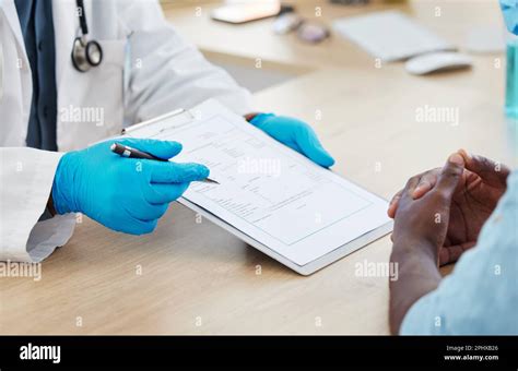 Insurance Forms And Doctor With A Man For Healthcare Medical Advice