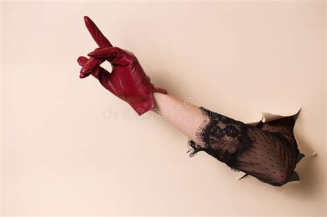 A Womanand X27s Hand In A Leather Glove Is Pointing With Her Index