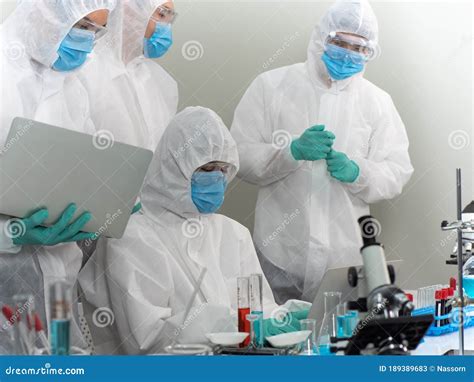 Scientist Team In Personal Protective Equipment Or Ppe Suit Is Busy
