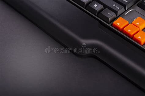 Orange Arrow Keys On A Black Keyboard Up Down Left Right Buttons On A Gaming Computer