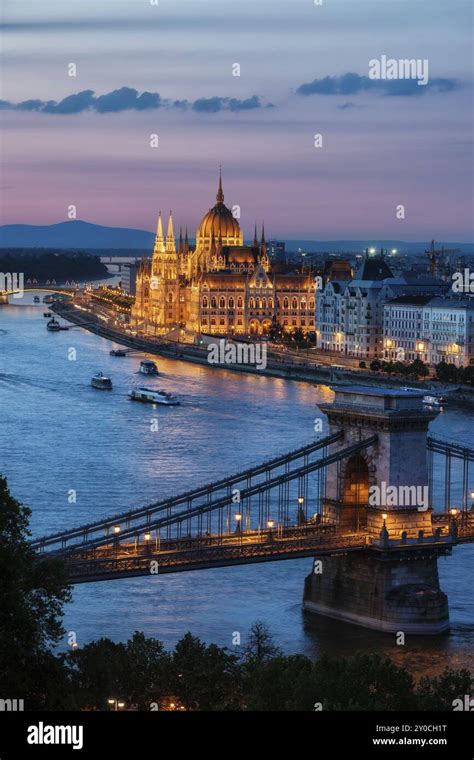 Budapest City At Dusk In Hungary Chain Bridge And Hungarian Parliament