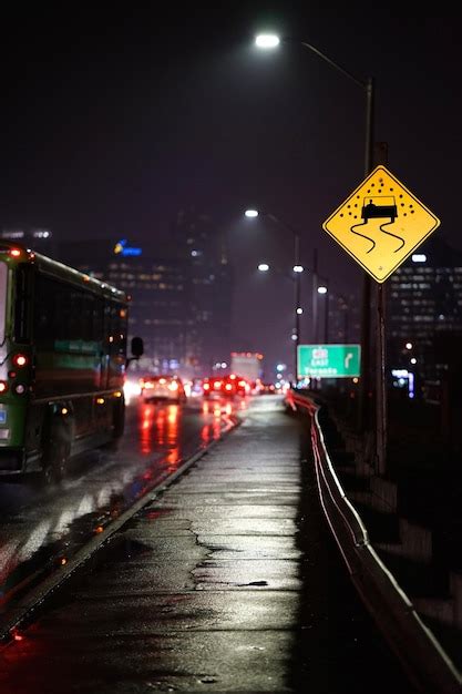 Premium Photo Illuminated Road Sign At Night