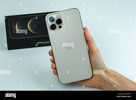 Iphone Pro Max In Gold Next To Its Box Stock Photo Alamy