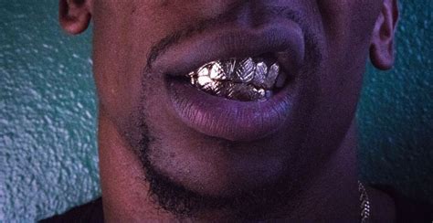 The History Of Putting Grills And Diamonds On Teeth Toothology Dental