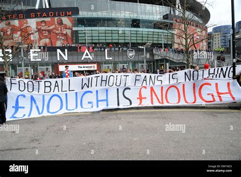 Football Fans Gather Outside The Emirates Stadium Before The Match