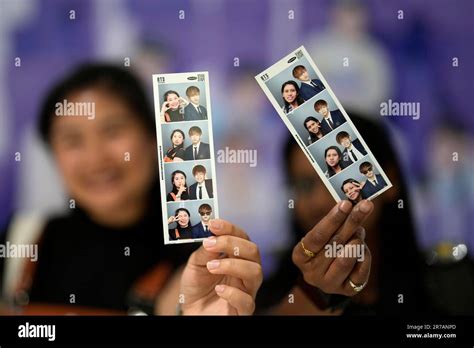Bts Fans Show Their Souvenir Photo During An Event To Celebrate The