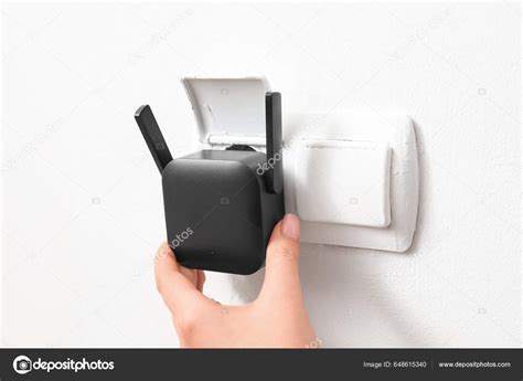 Woman Plugging Black Wifi Repeater Electric Socket White Wall Stock Photo By Serezniy