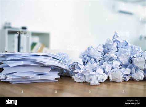 Paperwork Is Piling Up A Pile Of Crumpled Up Paperwork Sitting On An