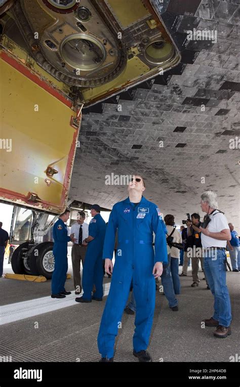 Sts 133 Pilot Eric Boe Admires Space Shuttle Discovery On The Shuttle