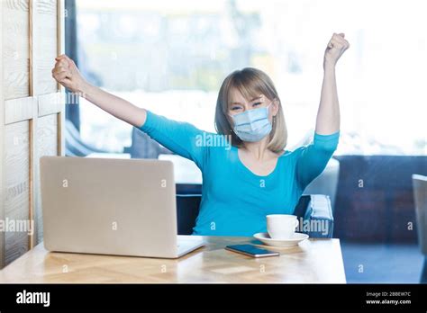 Yes Portrait Of Happy Young Woman With Surgical Medical Mask In Blue T
