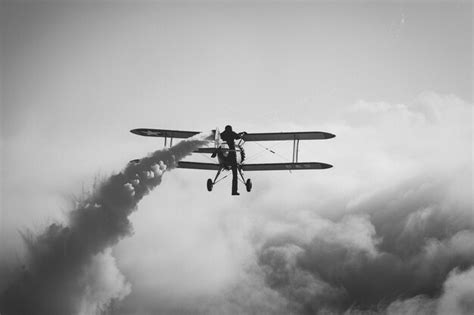 Premium Photo A Plane With A Propeller Flying Through The Clouds