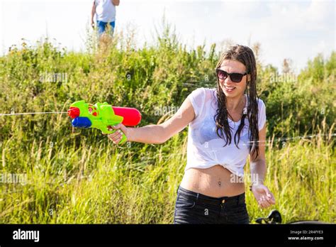 Children playing Water battle, water game battle Stock Photo - Alamy