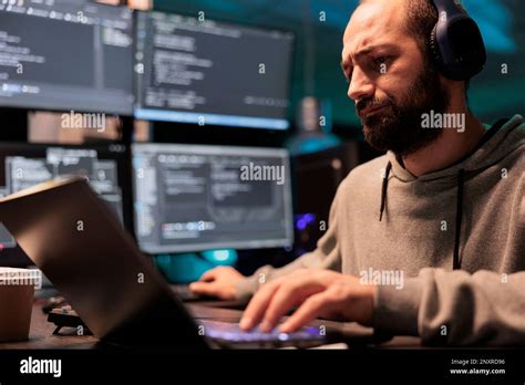 software developer programming user interface on computer and compiling source code with html