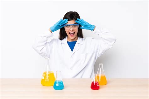 Premium Photo Young Scientific Woman In A Table With Surprise Expression