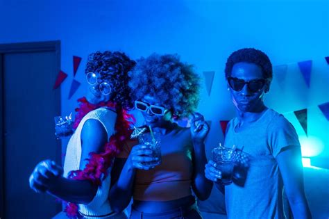 Multiethnic Students Partying At Home At Night Premium Photo