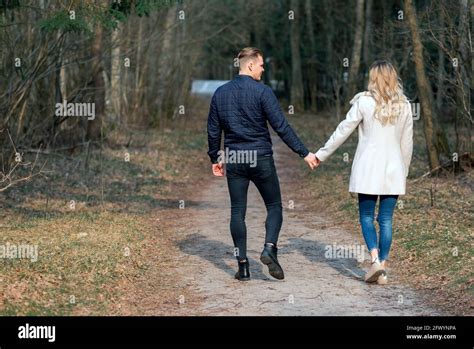 Beautiful Loving Couple Going For A Walk In A Forest In The Spring