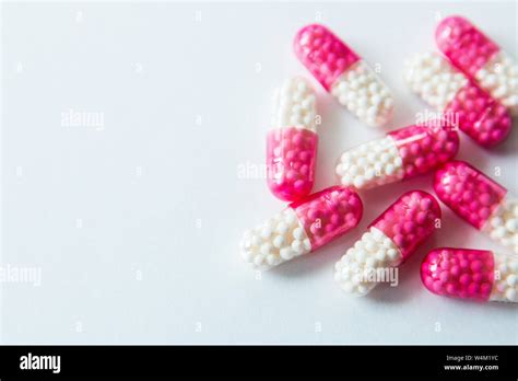 Pink Capsules Isolated On White Background Copyspace For Text