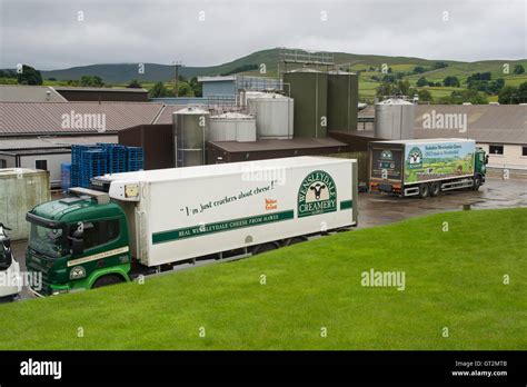 In The Rain 2 Lorries With Logos Parked Outside The Cheese Factory