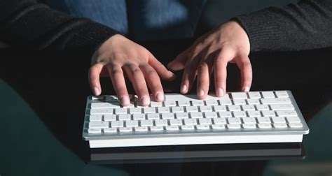 premium photo caucasian female hands typing in computer keyboard