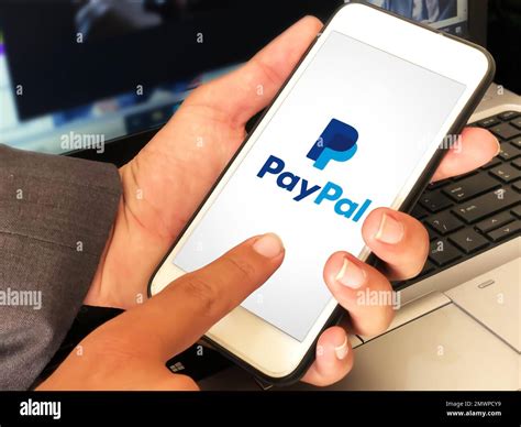 29 1 Pakistan Online Payment Gateway Editorial Background With Person Touching The Paypal