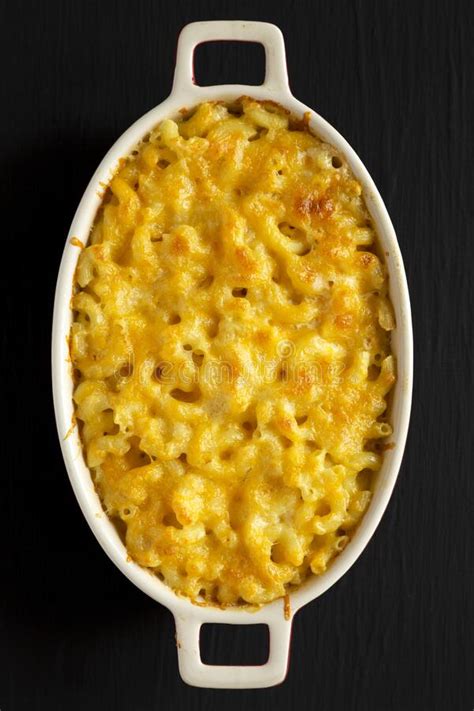 Homemade Macaroni And Cheese Pasta On A Black Background Top View