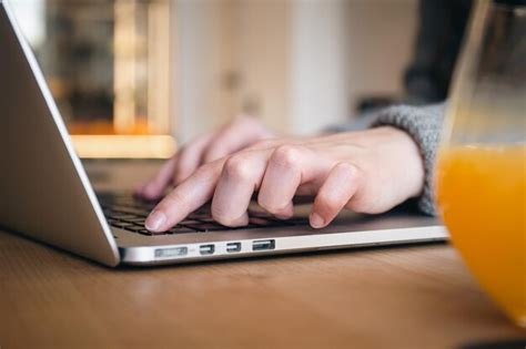 Premium Photo Closeup Female Hands Are Typing On A Laptop