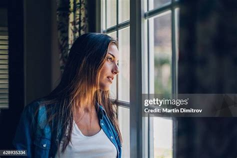 Person Staring Out Window Photos And Premium High Res Pictures Getty
