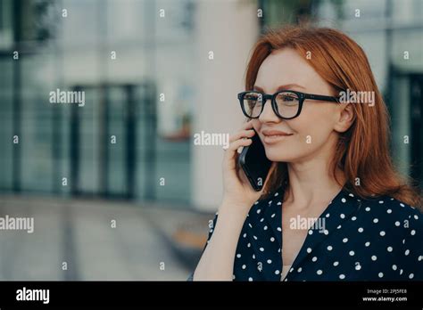 Redhead Businesswoman Has Telephone Conversation Uses Modern Cellular Gadget For Consultancy