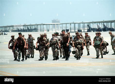 Newly Arrived Personnel Are Led Across The Flight Line To A Terminal
