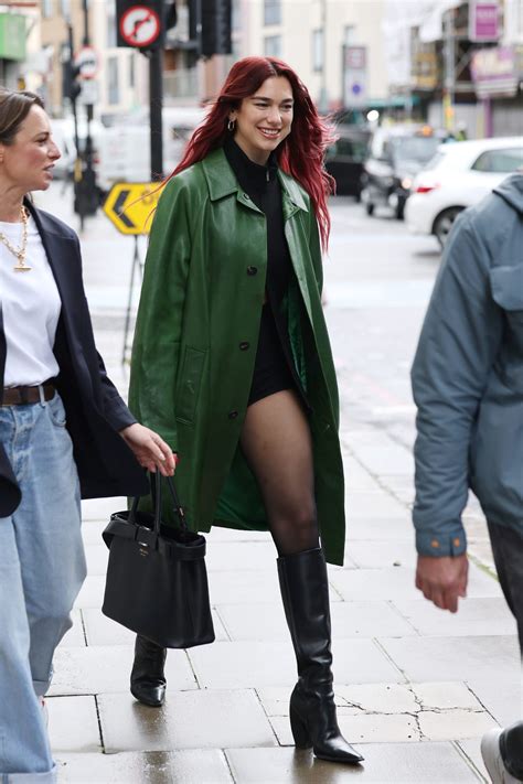 Dua Lipa Masters The Pantsless Trend For A Rainy Day In London