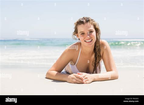 Woman Lying On The Beach Stock Photo Alamy