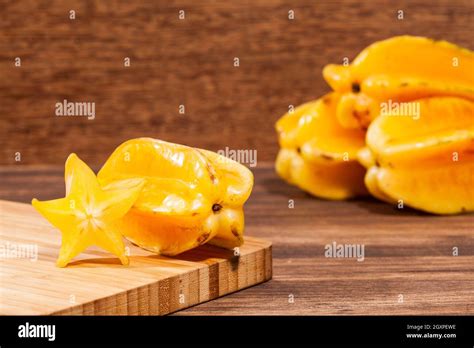 Averrhoa Carambolo Star Fruit Or Carambola Photo On Wooden