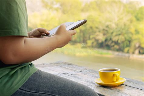 Hands Of Young Woman Using Two Phones Simultaneously Happy Woman Use Two Modern Smartphones