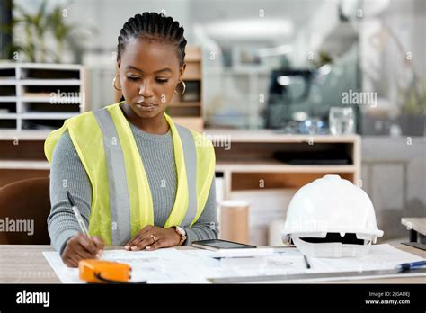 Dreaming Up New Cityscapes A Female Engineer Drawing Up Blueprints Stock Photo Alamy