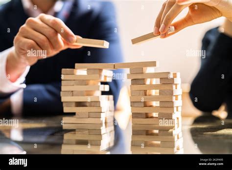 Human S Hand Placing Wooden Block Stock Photo Alamy