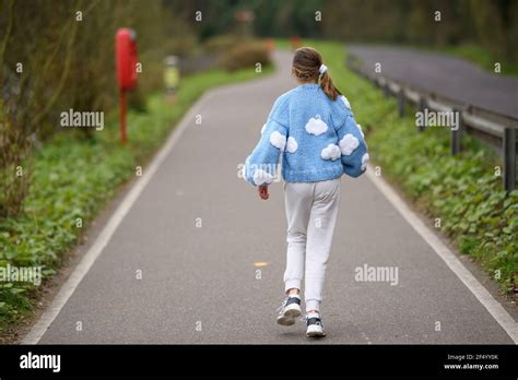 Girl Running On A Path Stock Photo Alamy