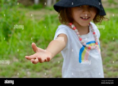 Girl Holding Out Hand With Invisible Object Herveys Range Heritage Tea