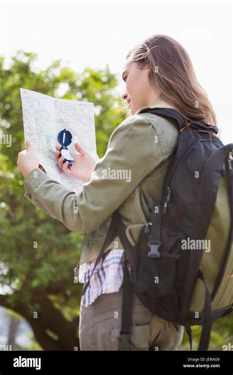 Woman Using Map And Compass Stock Photo Alamy
