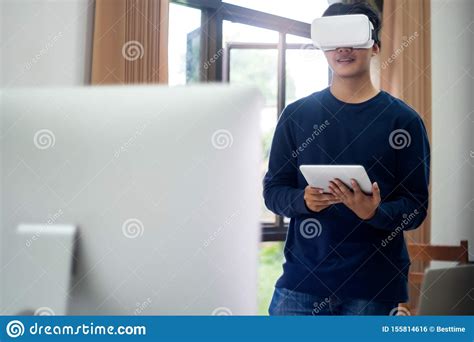 It Engineer And Programmer Testing Software And Working With Vr Headset