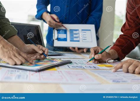 A Team Of Web Designers With The Ux Ui System Are Writing Programs And Layers To Customize The