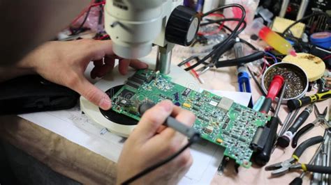 Man Looks At Motherboard Through Microscope And Stock Footage Video Of Hands Detail 322720250