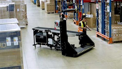 container unloader from tawi expedites unloading material handling 24 7