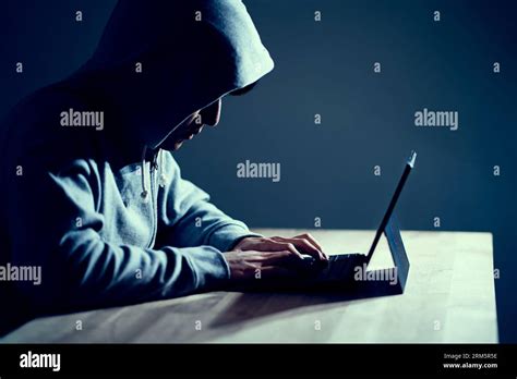 Male Hacker Writing Code On A Laptop Stock Photo Alamy