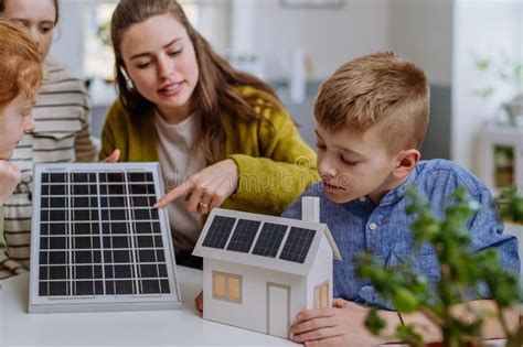 Young Teacher With Solar Panel Learning Pupils About Solar Energy Stock Image Image Of