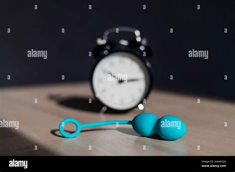 Alarm Clock And Vibrator On The Table Time For Training Intimate Muscles Vaginal Balls