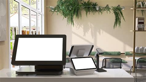 현대적이고 고급스러운 카페의 카운터에 태블릿과 바코드 리더가 있는 빈 컴퓨터 터치 스크린이 있는 디지털 금전 등록기의 폐쇄 금전